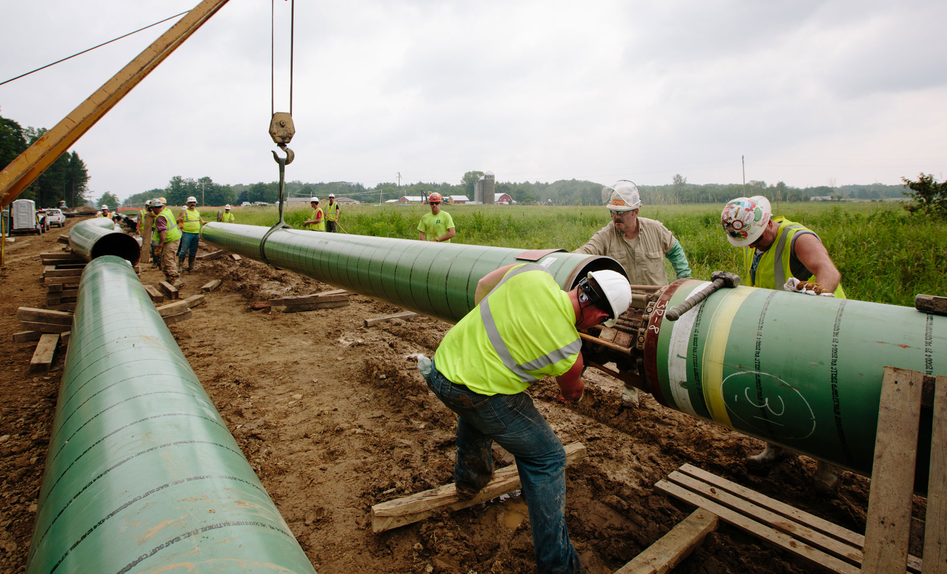 Pipeline Industry Workers Installing New Cude Oil And Natural Gas