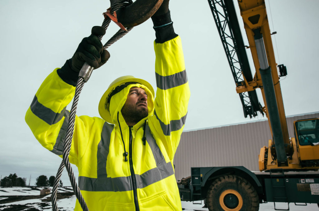 kwik-safety-reflective-hi-vis-jacket-crane-operator-hooking-cable-4873 ...